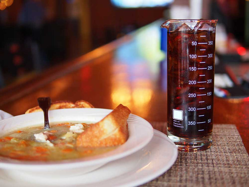 Capturing the reaction between laboratory glass and drinkware.